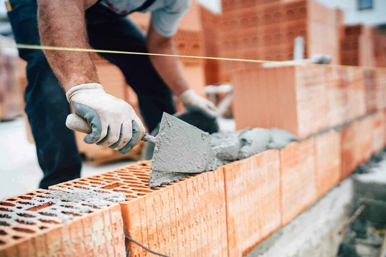 How to build a brick wall in a construction site - step by step
